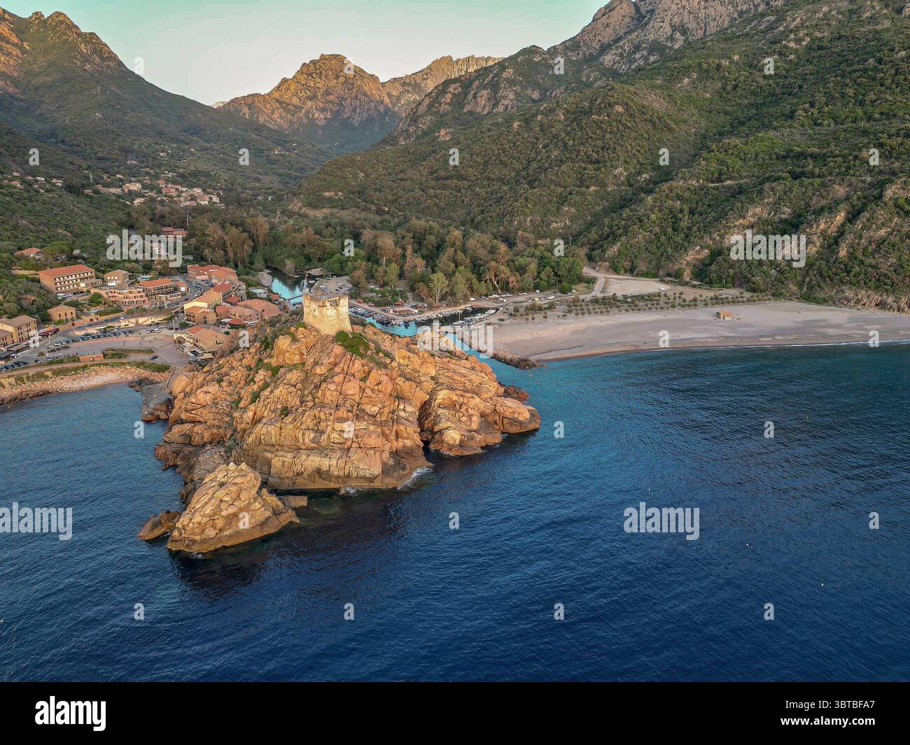 Aerial view town and ruins of the Genoese tower of Porto, Corsica ...