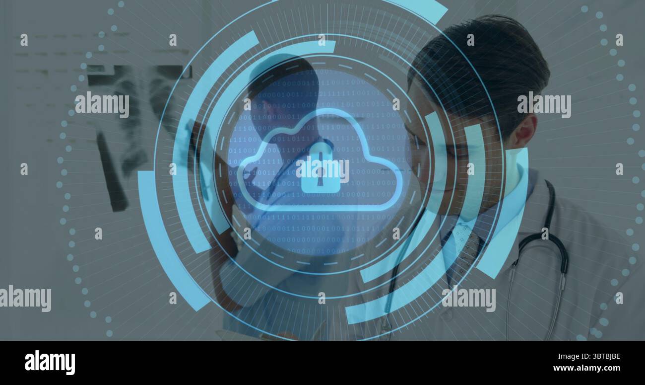 Reviewing chest X-ray film on viewer, doctors examining in clinic with ...