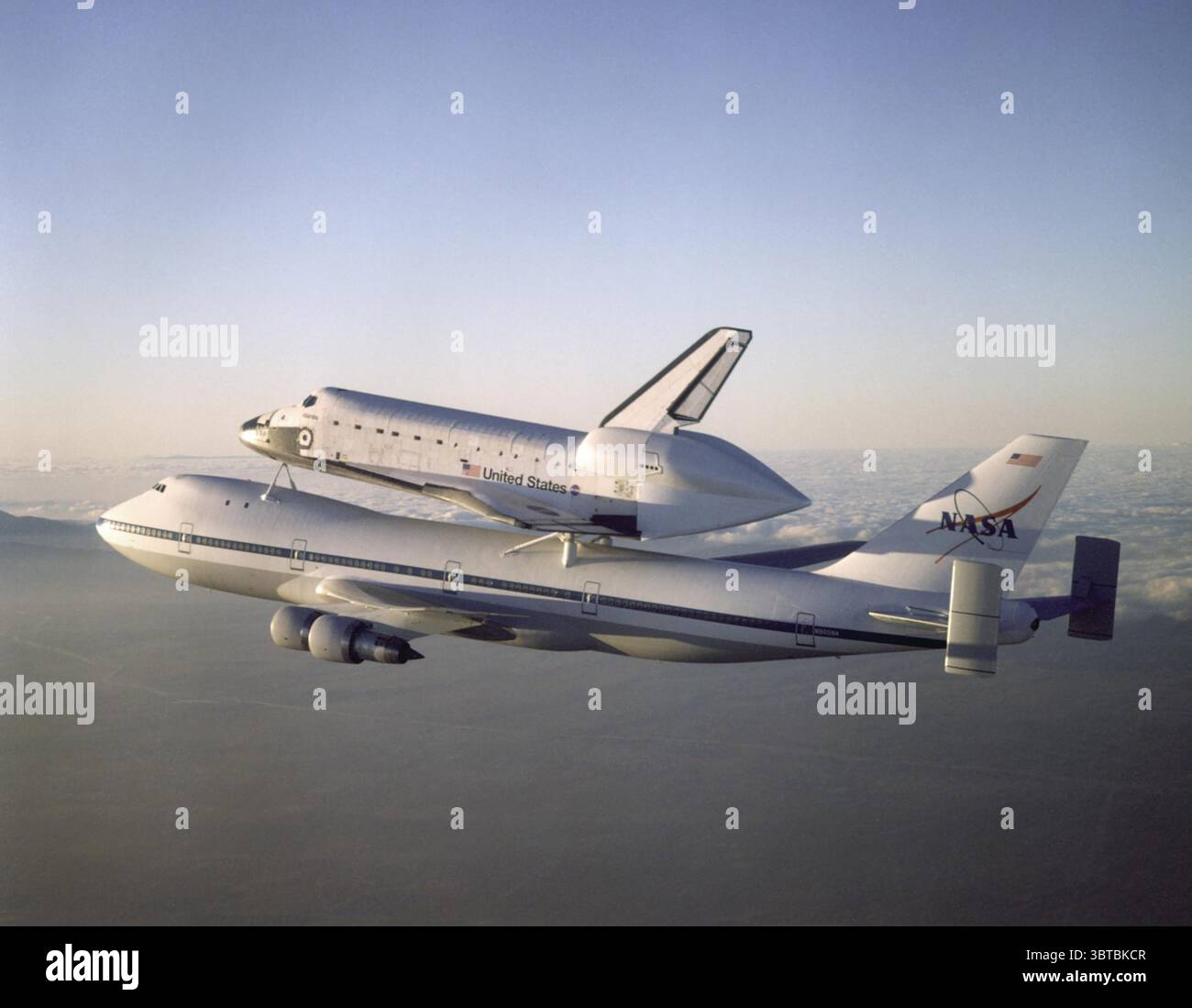 EC98-44740-1 The Space Shuttle Atlantis rides on the back of one of ...