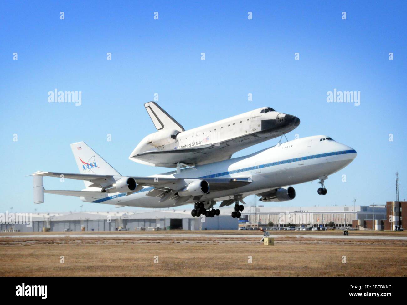 The space shuttle Endeavour, atop a modified Boeing 747, taxis toward ...