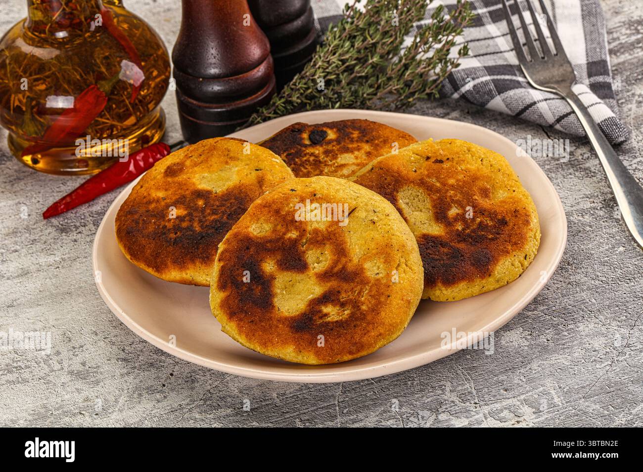 Georgian cuisine - yellow Corn bread Mchadi Stock Photo - Alamy