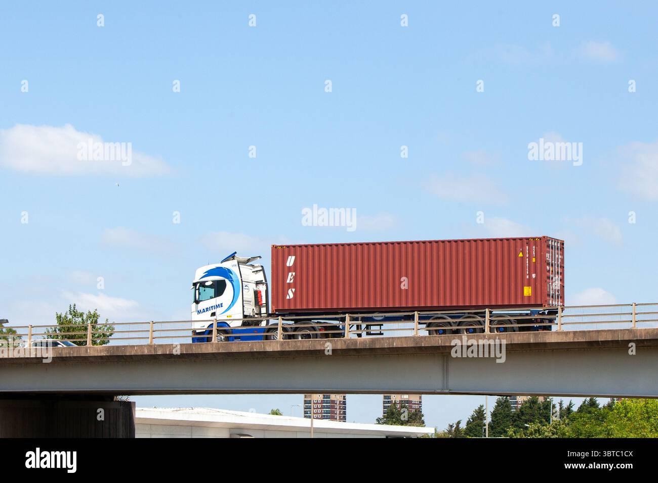 A Maritime Transport articulated lorry with a red intermodal UES ...