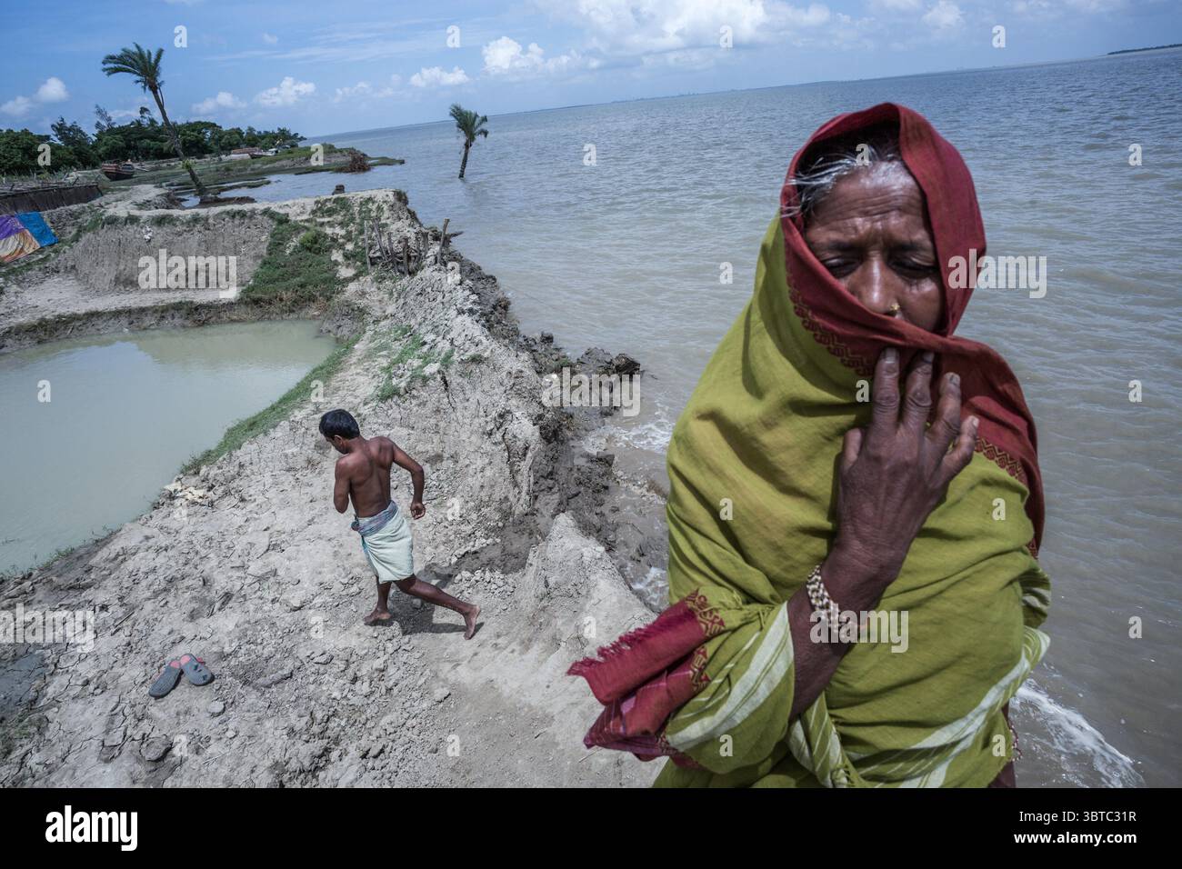 September 11, 2015, West Bengal, India: An old woman is standing over a ...