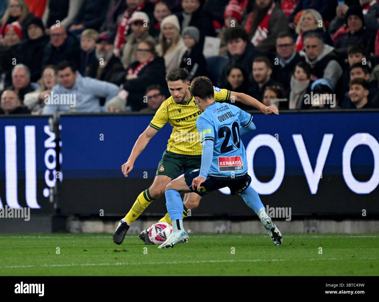 Ryan Barnett of Wrexham and Tiago Quintal of Sydneym during the Soccer ...