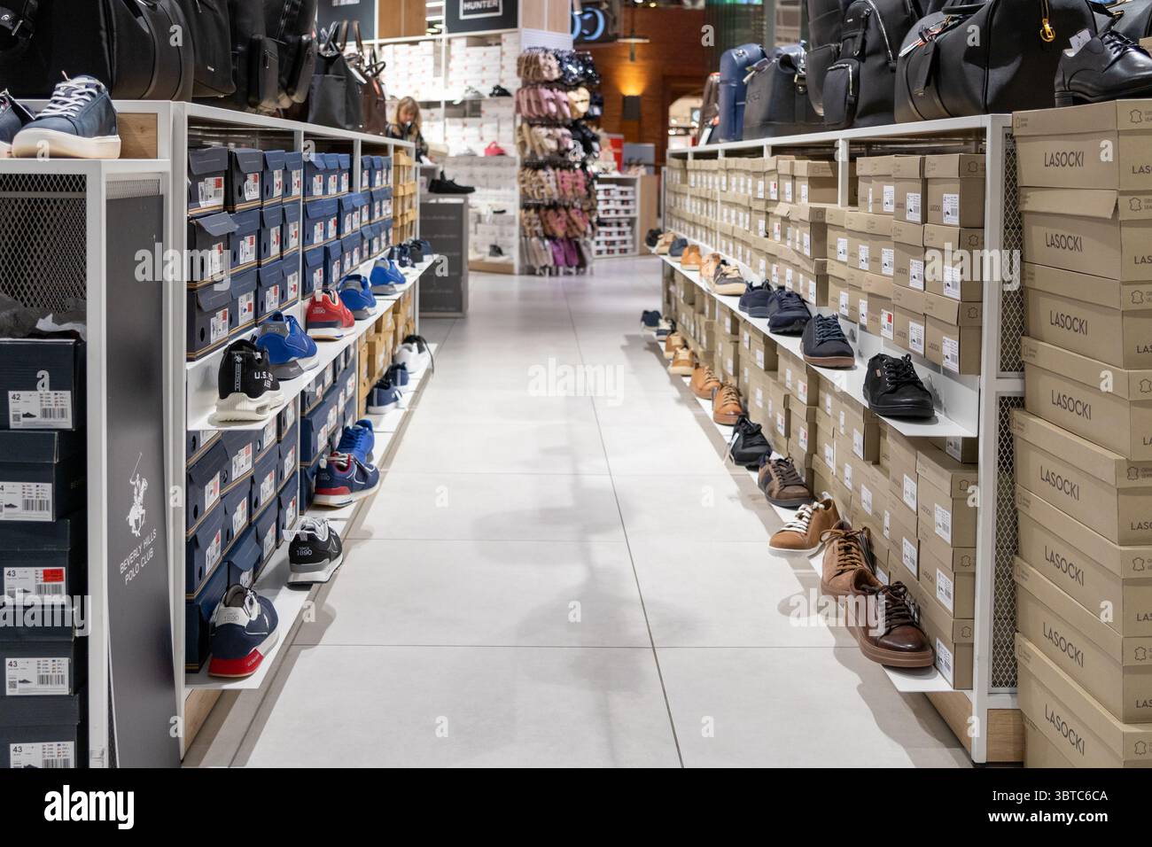Poznan, Poland - June 30, 2025: An inviting modern shoe store aisle ...