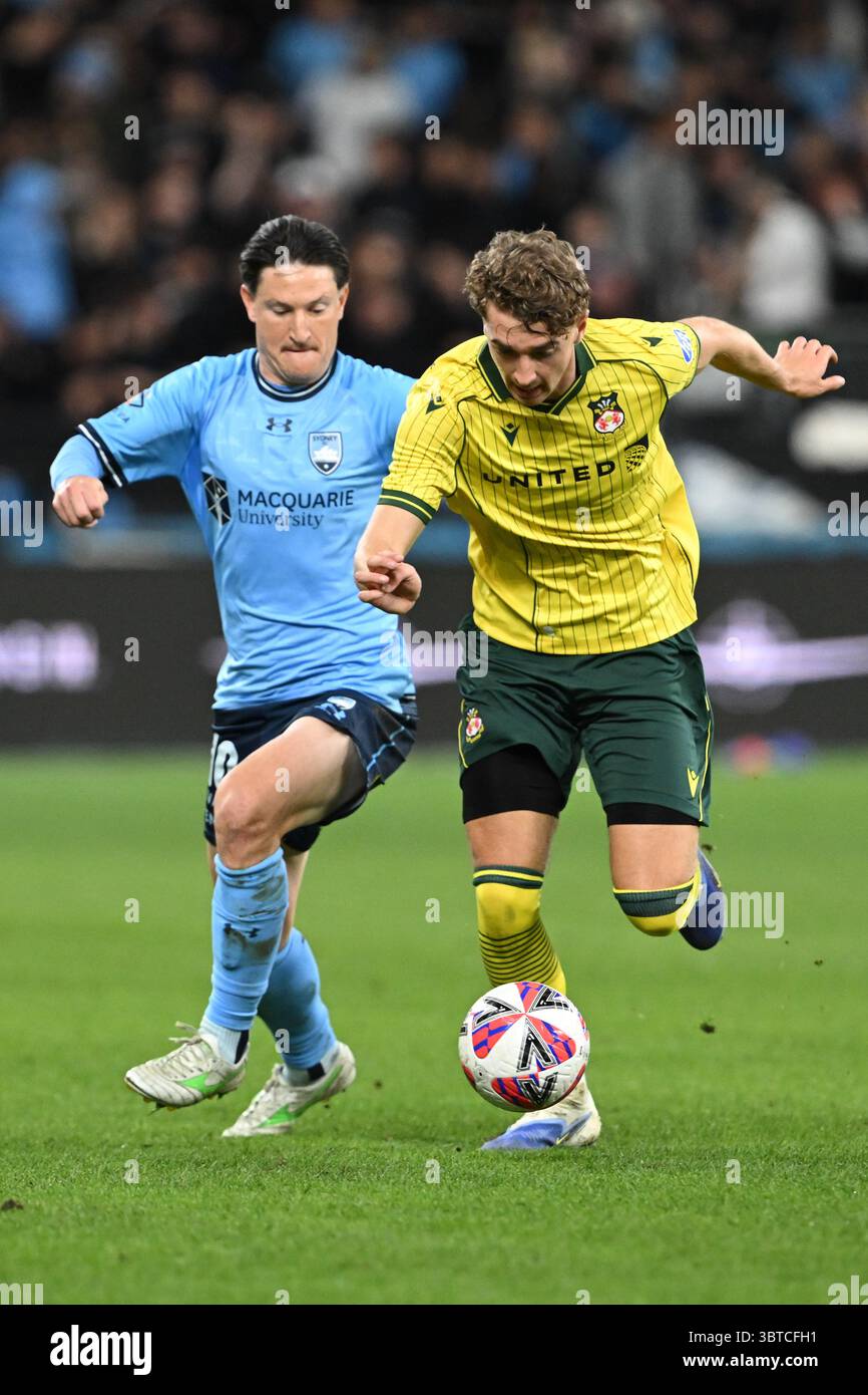 Lewis Brunt of Wrexham and Joe Lolley of Sydney during the Soccer ...