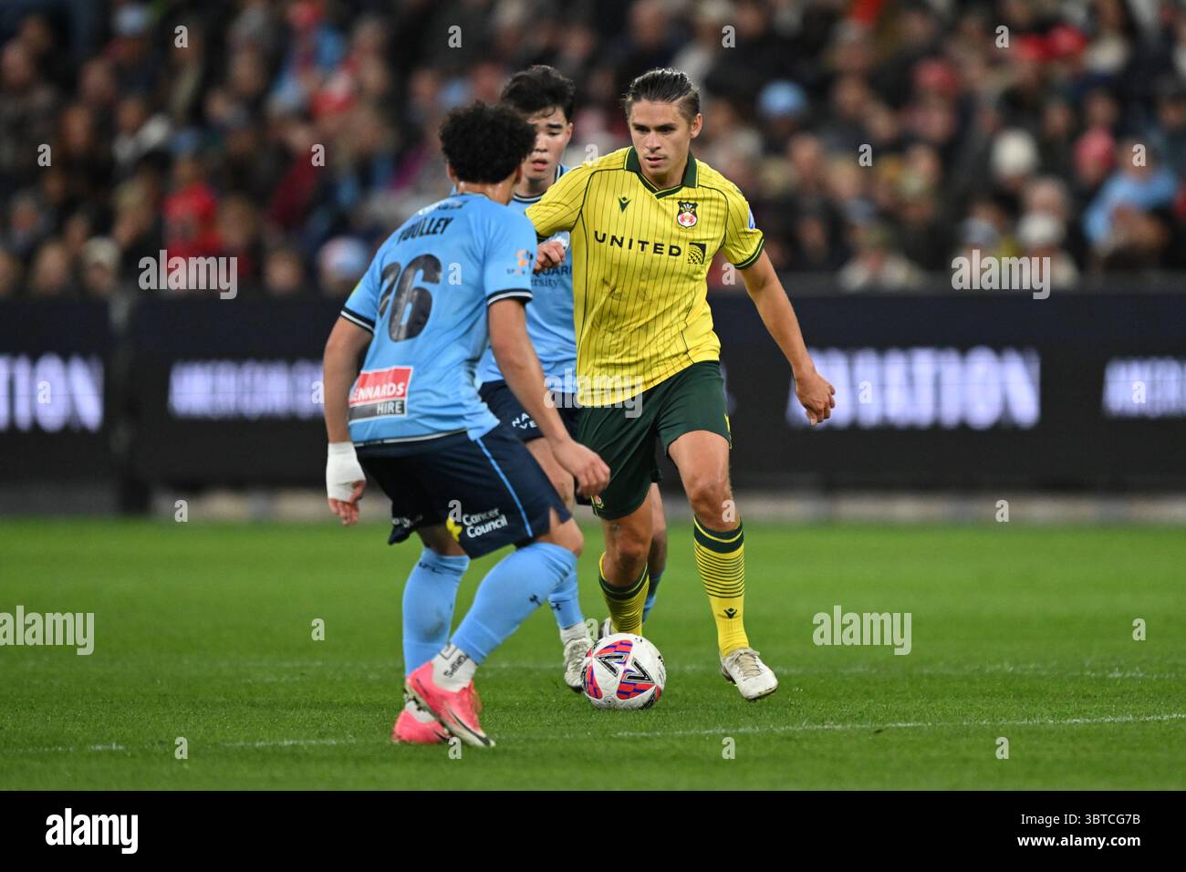George Dobson of Wrexham and Rhys Youlley of Sydney during the Soccer ...