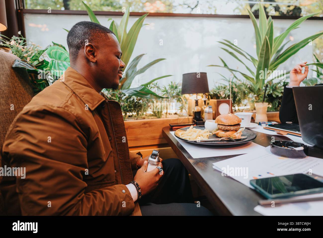 Diverse Entrepreneurs Meeting Over Lunch Brainstorming in a Modern ...