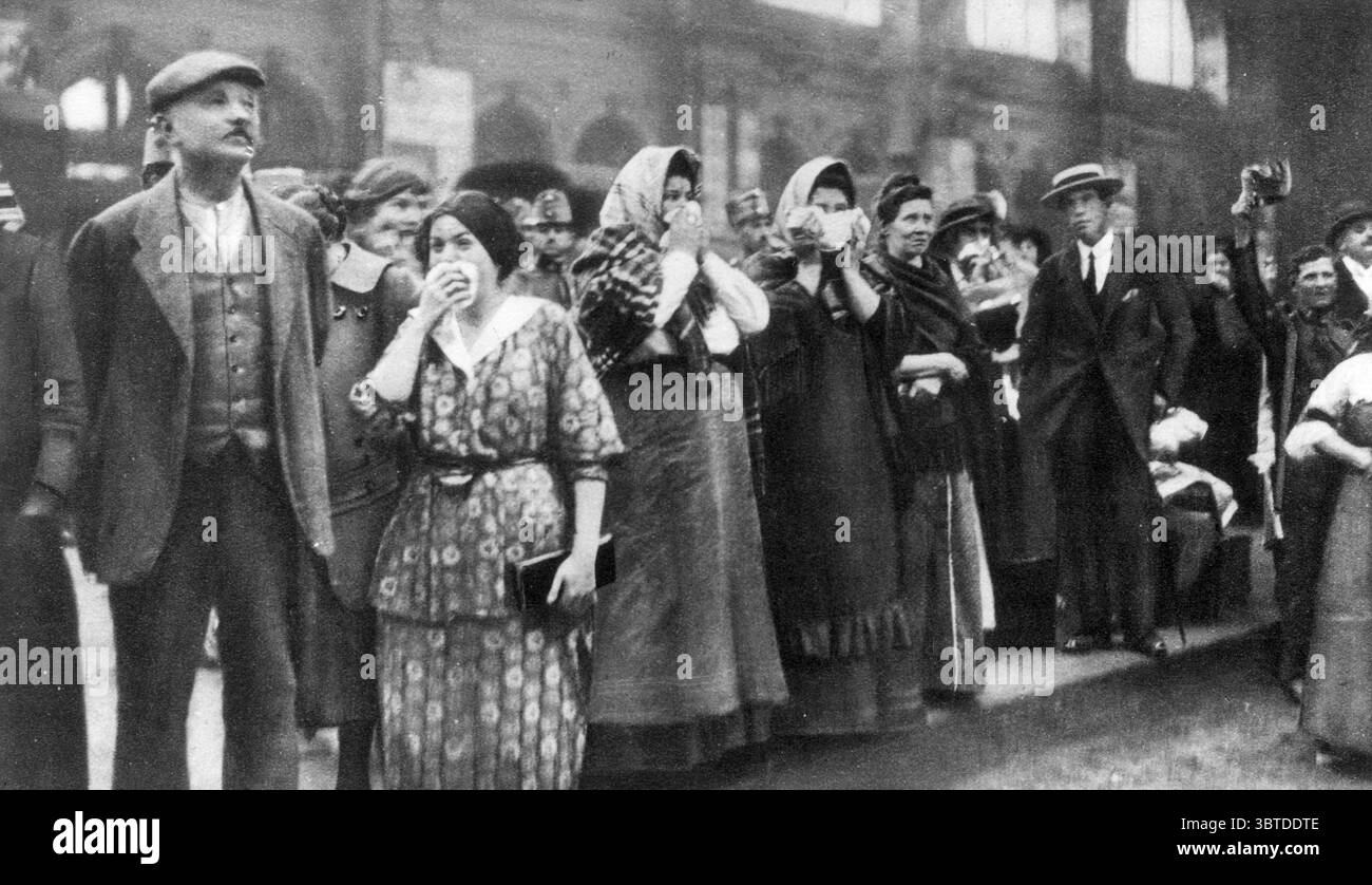 Women, friends, and family, weep as they say goodbye to troops headed ...