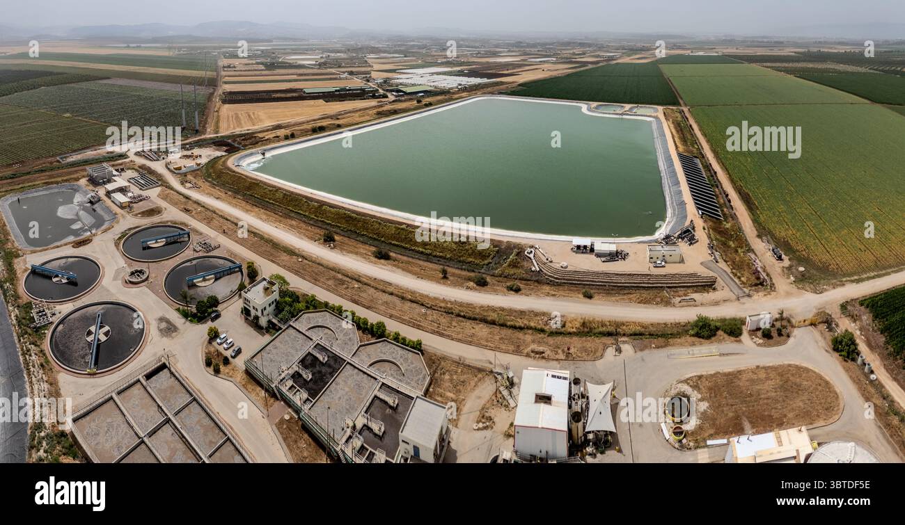 Aerial view of wastewater treatment plant contrasting with the ...