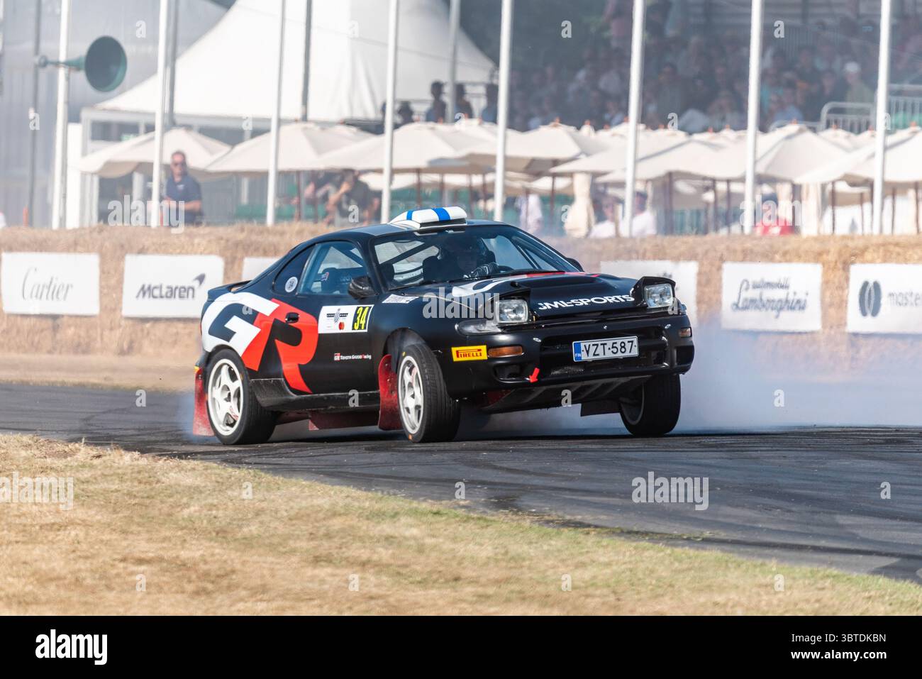 Toyota Celica ST185 classic rally car driving up the hillclimb track at ...