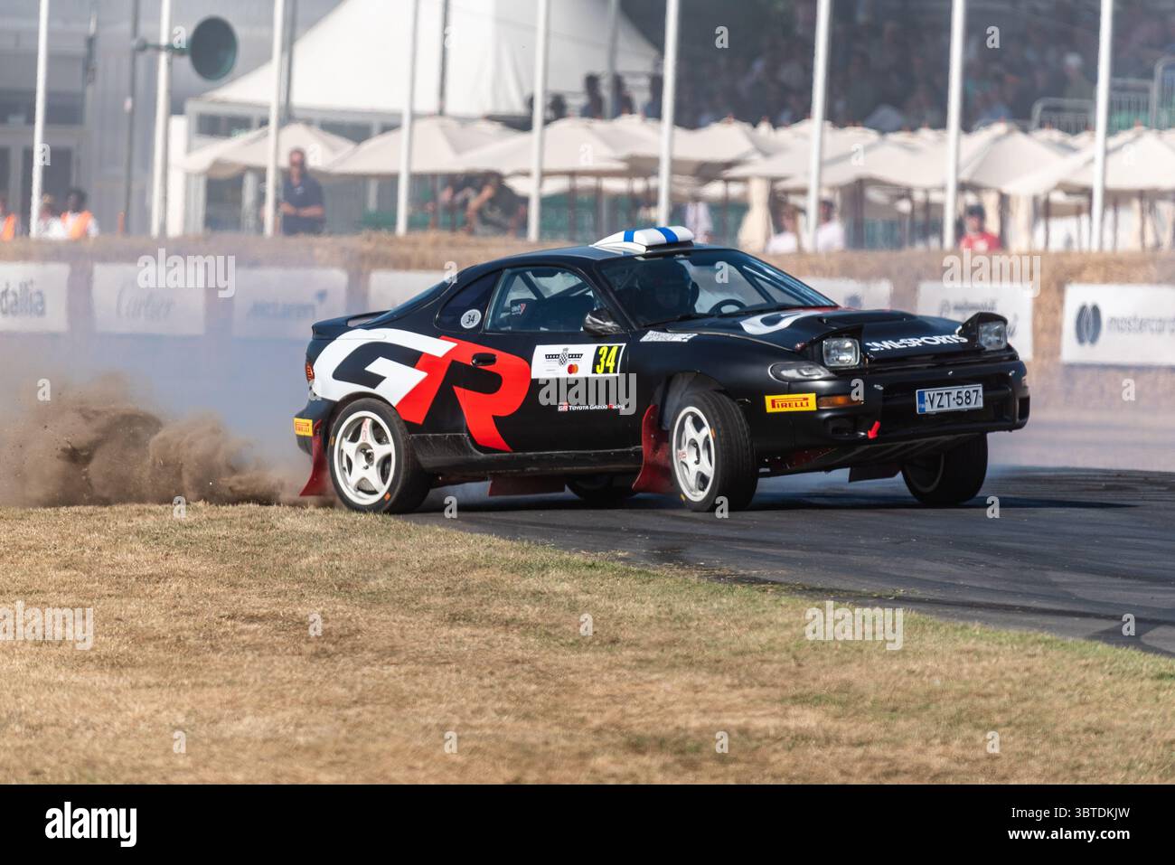 Toyota Celica ST185 classic rally car driving up the hillclimb track at ...