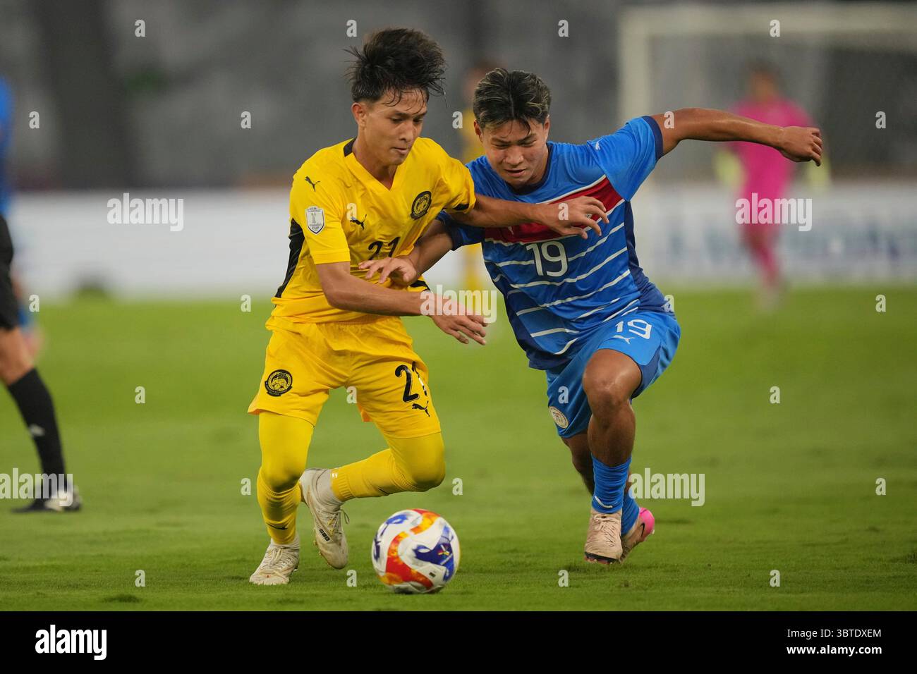Malaysia's Muhammad Aiman Yusuf Bin Muhammad Nabil, left, battles for ...