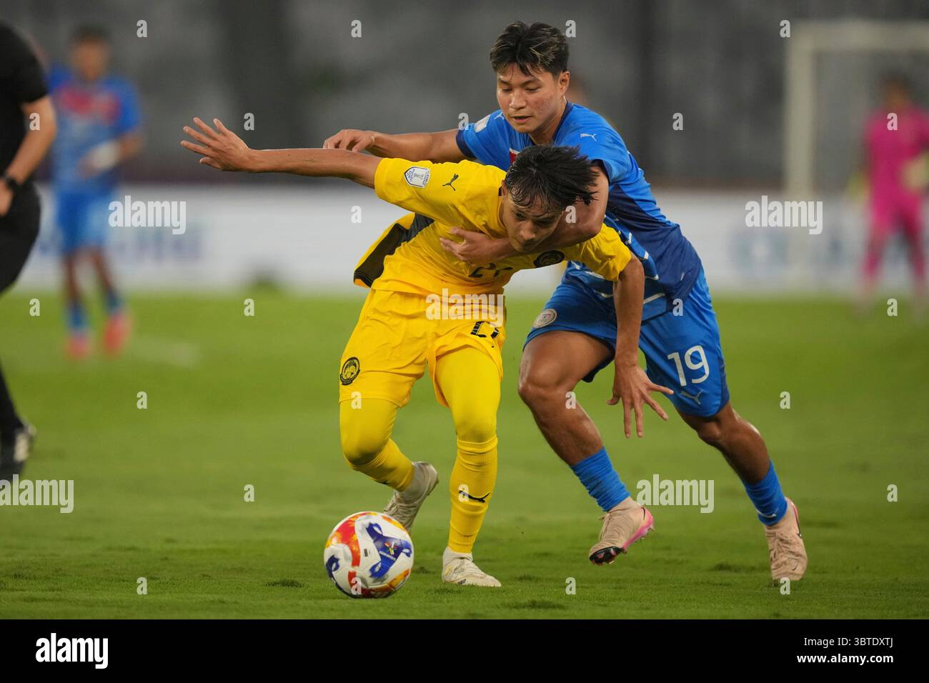 Malaysia's Muhammad Aiman Yusuf Bin Muhammad Nabil, front, battles for ...