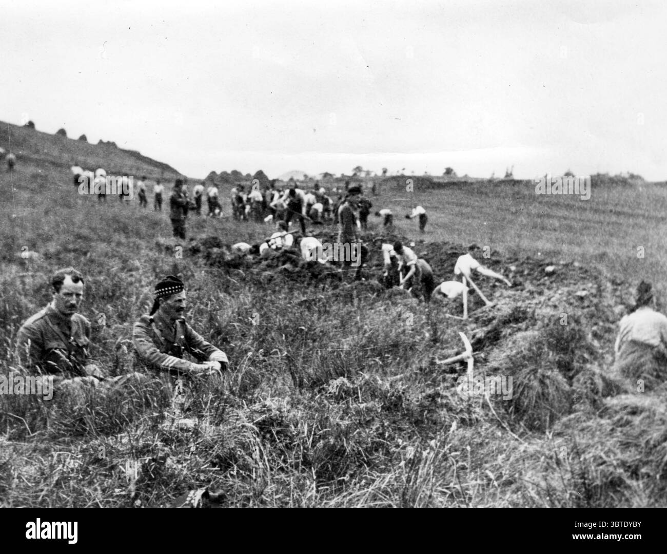 Men of the 8th Royal Scots digging trenches , Captain G Suttle and ...