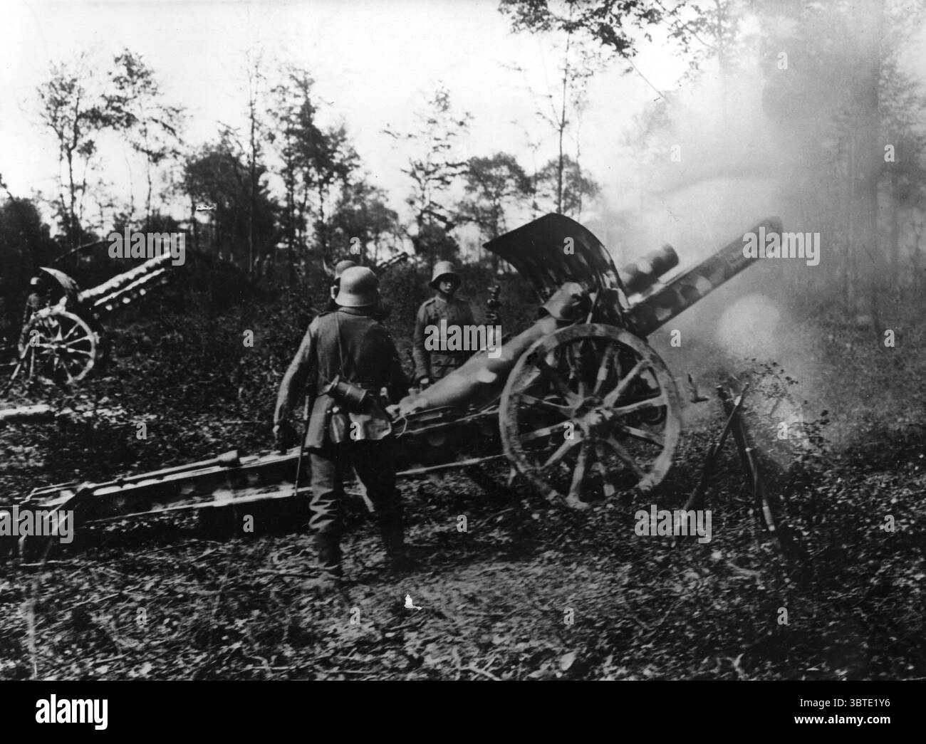 Krupp 105mm field howitzer fireing note the recoild of the foremost gun ...