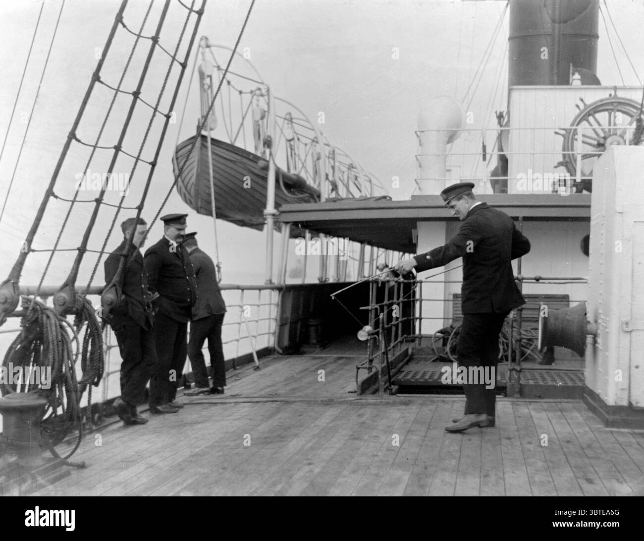 British Navy . Ships Officer playing Diabolo on deck made from two Hand ...