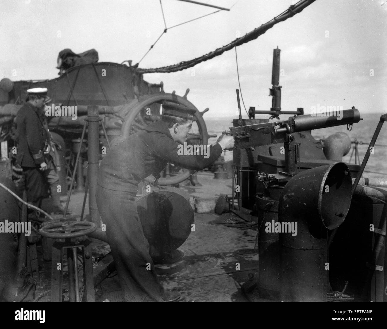 British Royal Navy . A Maxim gun being operated by a sailor on the HMS ...