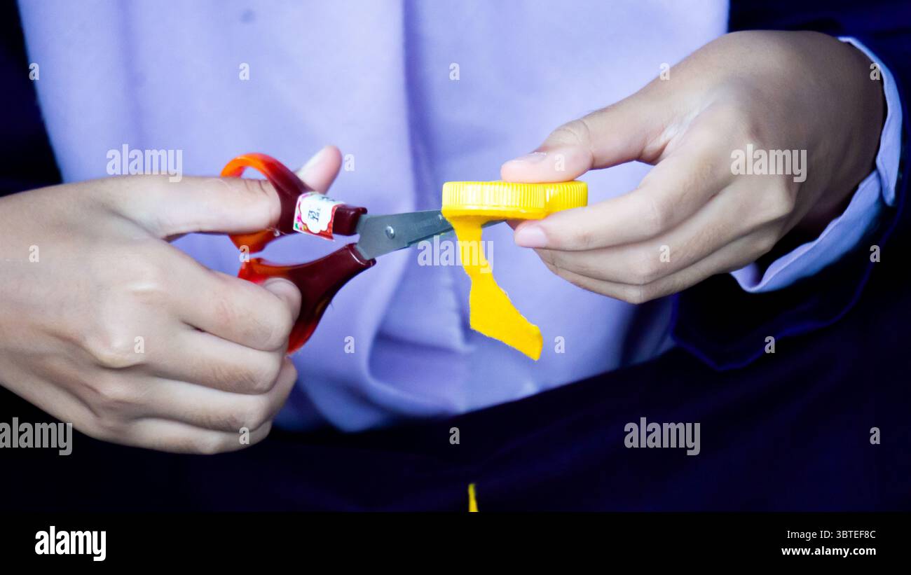 Making key chains from bottle caps and flannel. Recycling plastic ...
