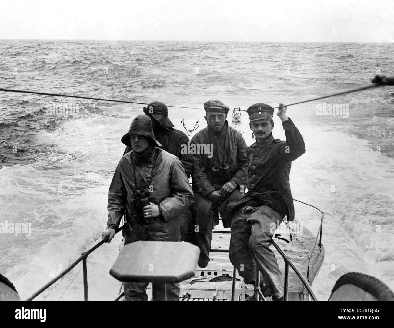 German Officers on the conning tower of a German submarine at sea Stock ...