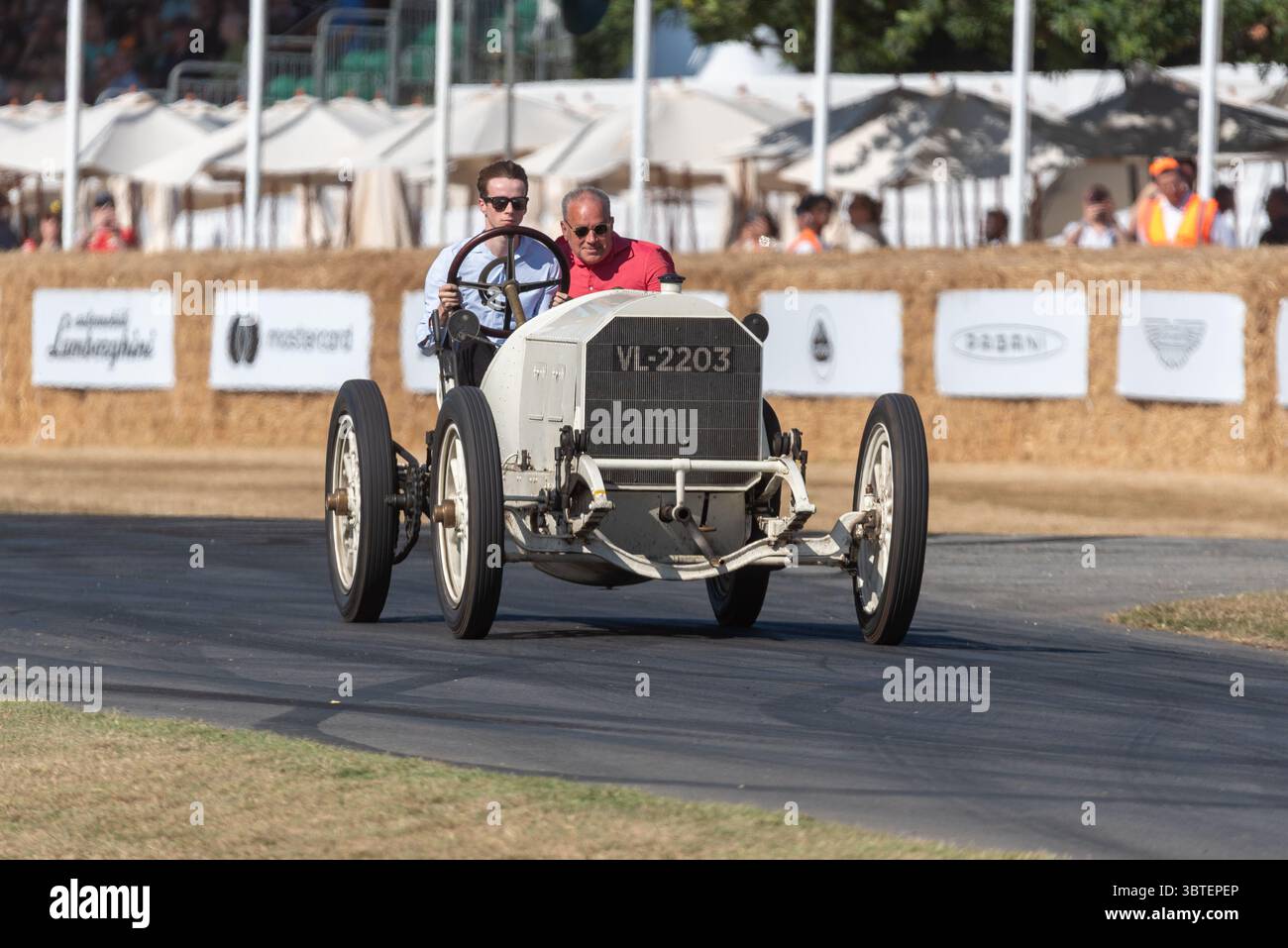 1907 Mercedes 120HP vintage car driving up the hillclimb track at the ...