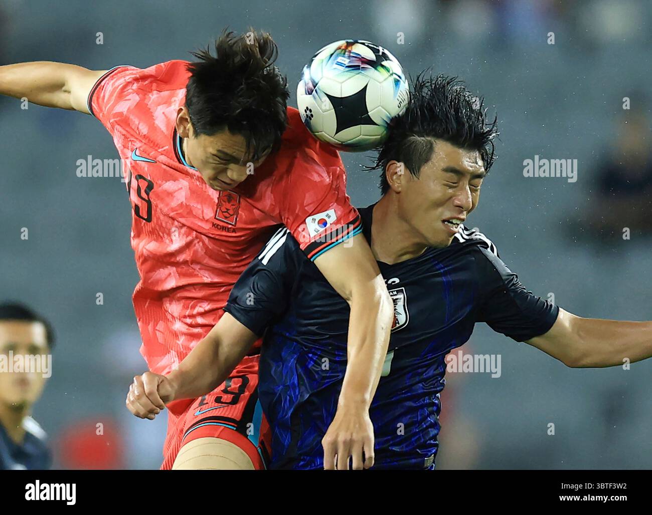 South Korea's Sehun Oh (19) and Japan's Taiyo Koga compete with heading ...
