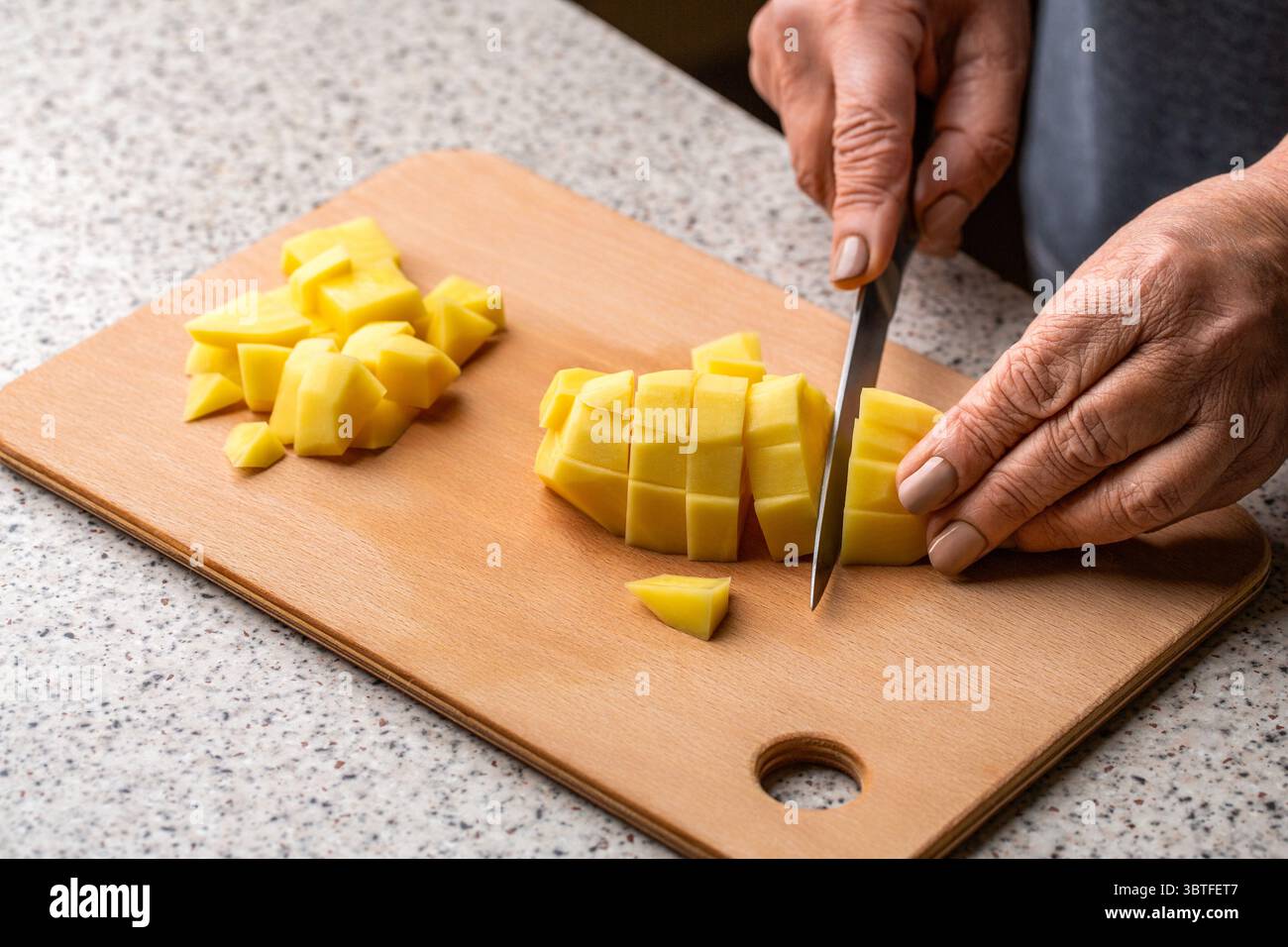 Man cuts potato on cutting hi-res stock photography and images - Alamy
