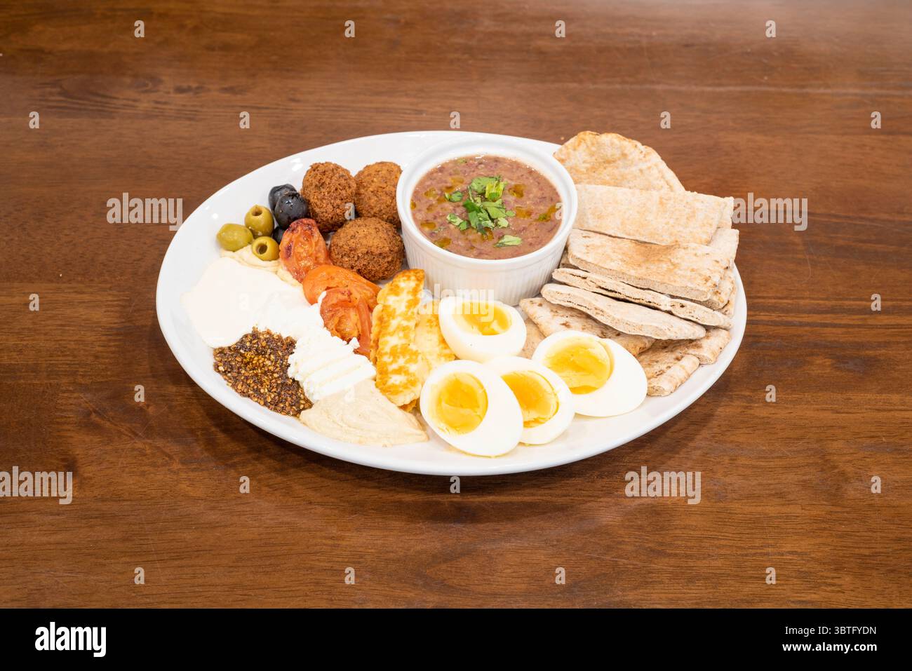 Mediterranean Breakfast with boiled eggs, grilled halloumi, spicy ...
