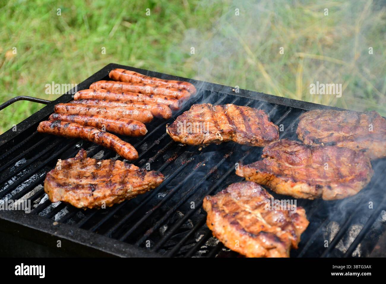 Setting up coals in grill hi-res stock photography and images - Alamy
