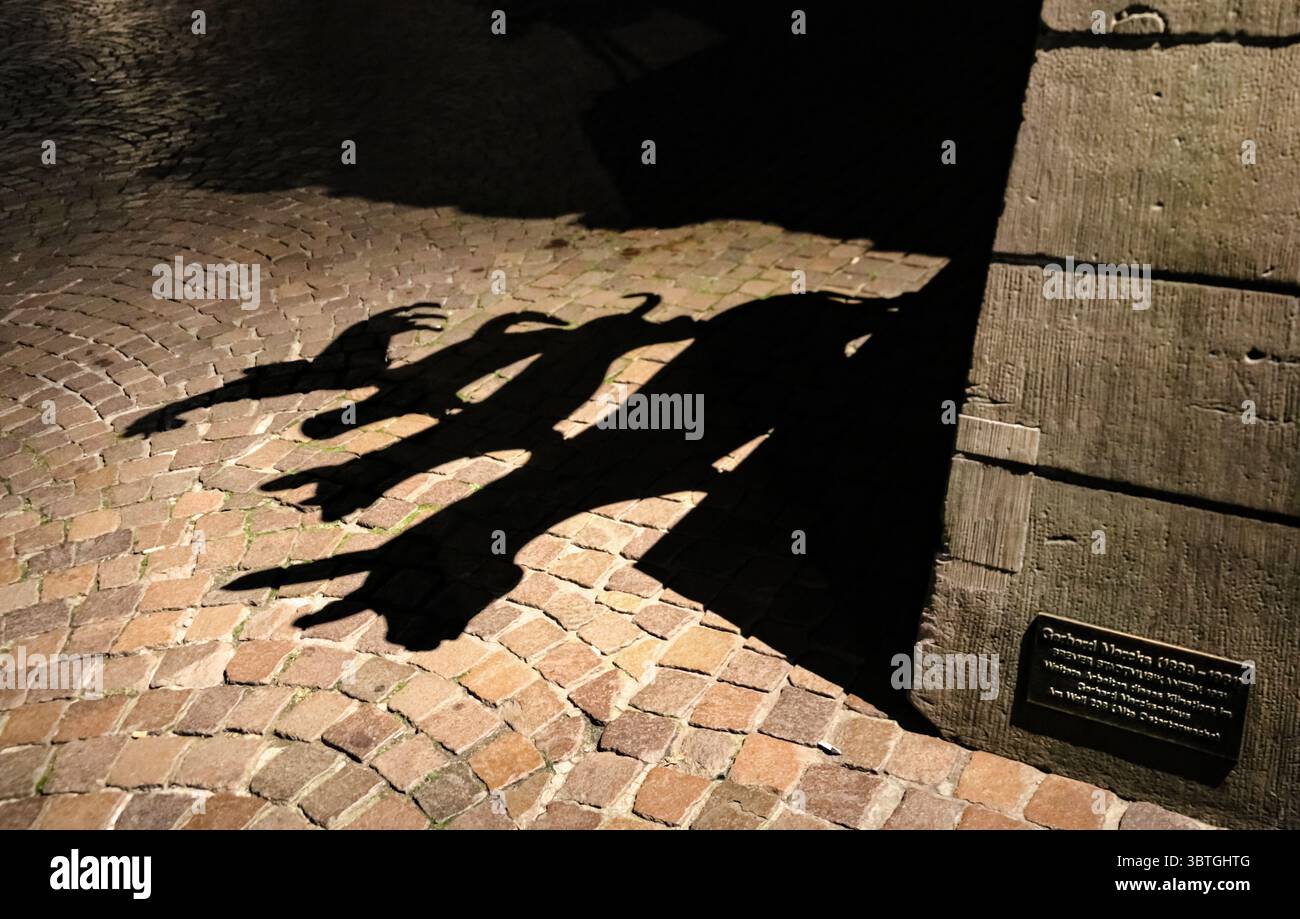 The shadow of the famous bronze statue of the Bremen Town Musicians ...
