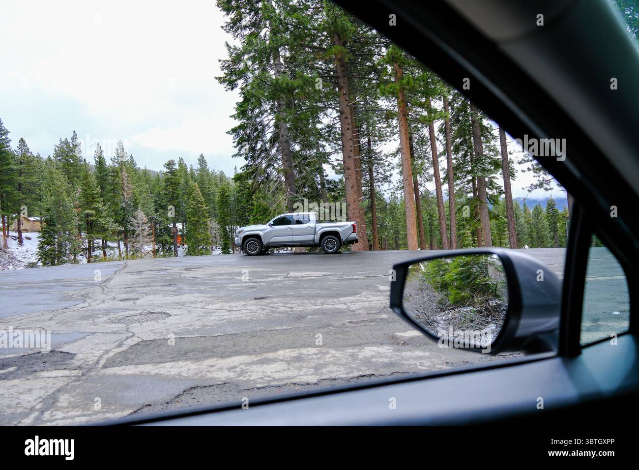 13 MAY 2025 - Tahoe, CA, USA - A 4x4 pickup truck parked in a forest ...
