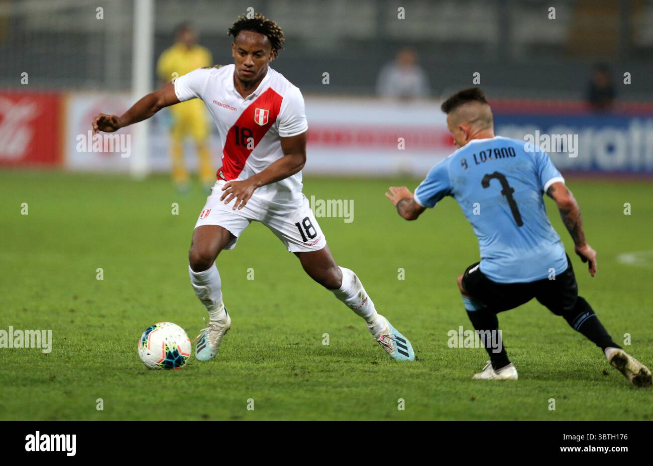 October 15, 2019, Lima, Peru: Peru's Andre Carrillo (L) and Uruguay's Brian Lozano fight for the ...