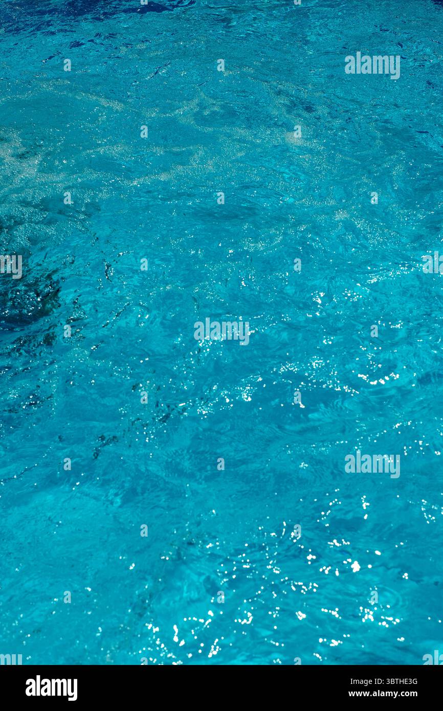 Rippling blue pool water reflecting sunlight Stock Photo - Alamy
