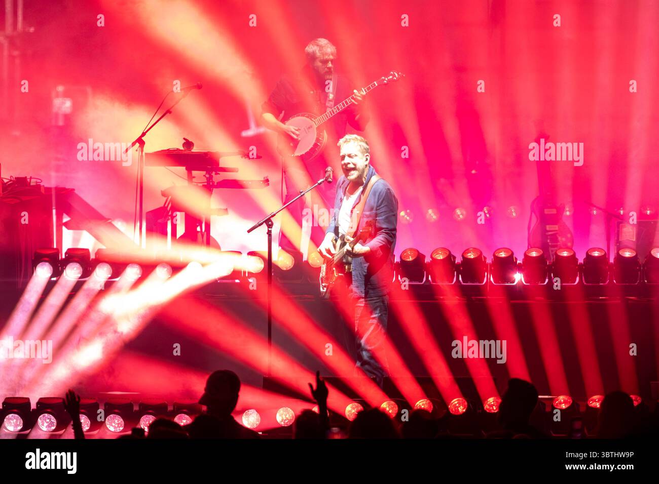Ted Dwane of the English indie-folk band Mumford & Sons play the bass ...
