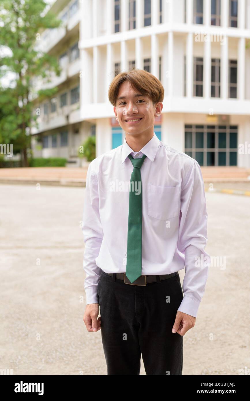 Non binary Asian university student in college campus Stock Photo - Alamy
