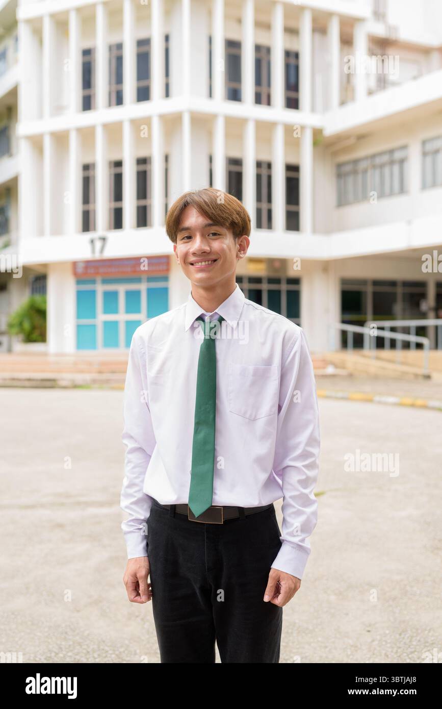 Non binary Asian university student in college campus Stock Photo - Alamy
