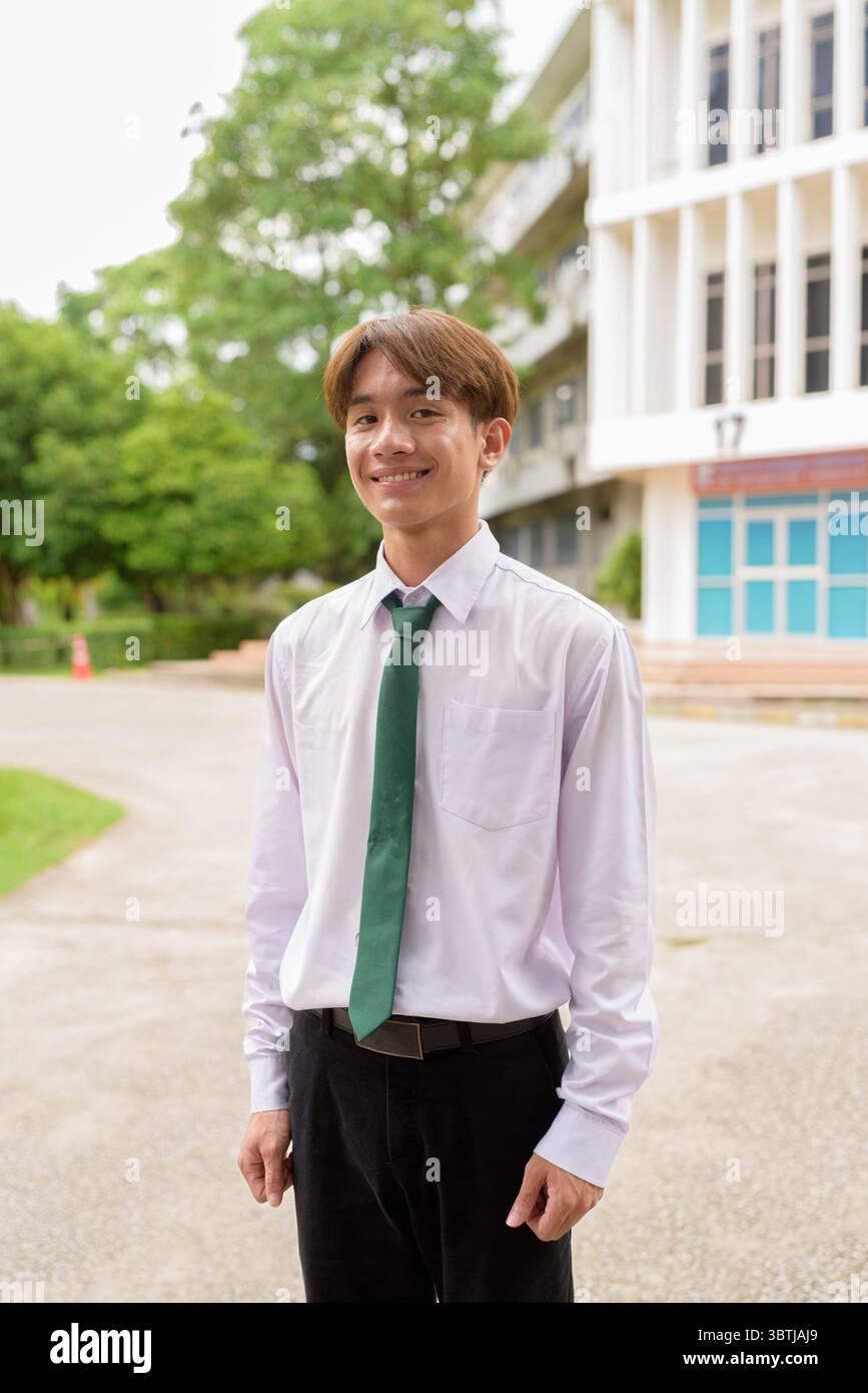 Non binary Asian university student in college campus Stock Photo - Alamy
