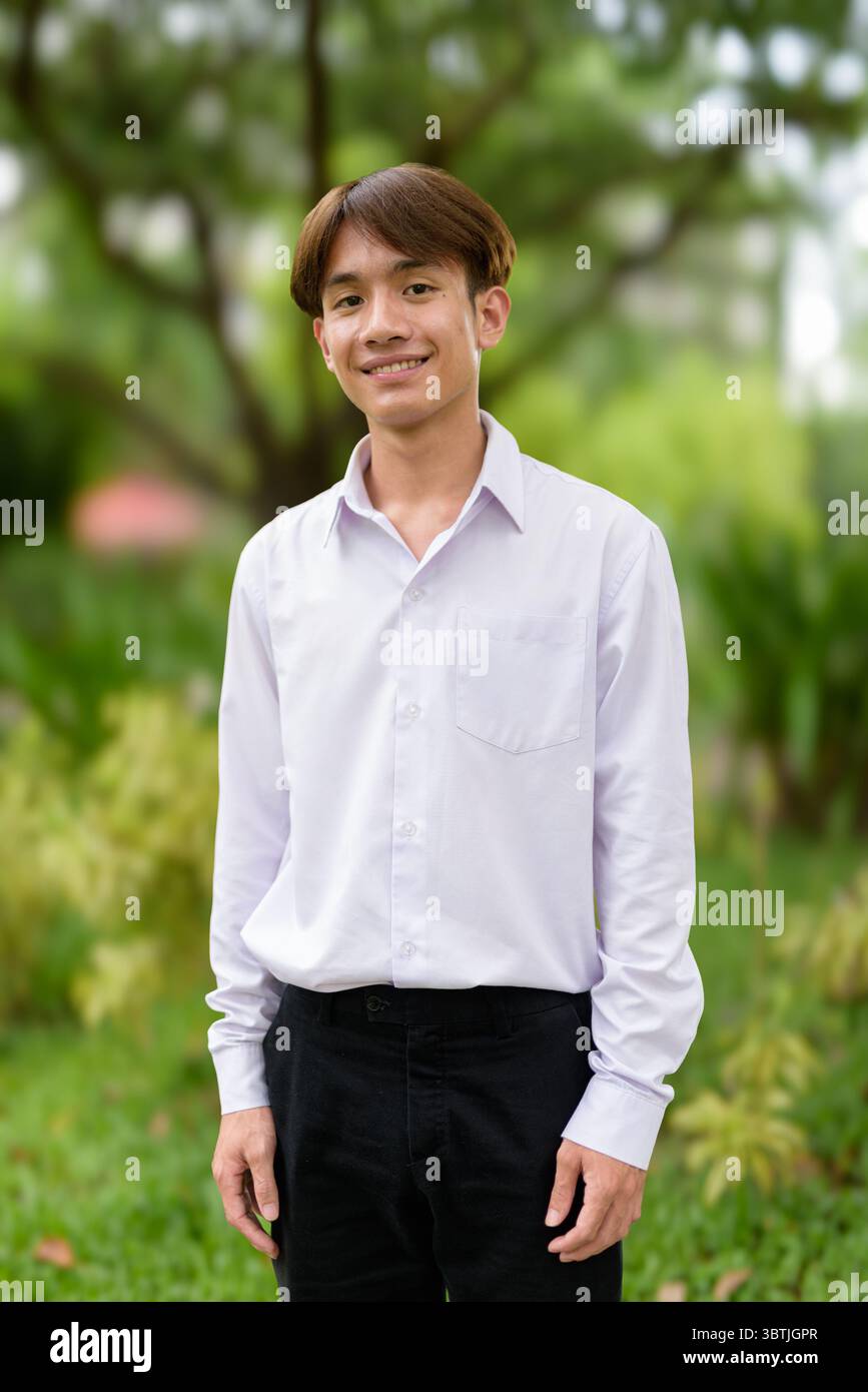 Non binary Asian university student in college campus Stock Photo - Alamy
