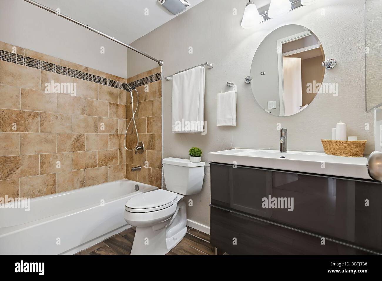 A welldesigned bathroom that includes a toilet, a sink for hand washing ...