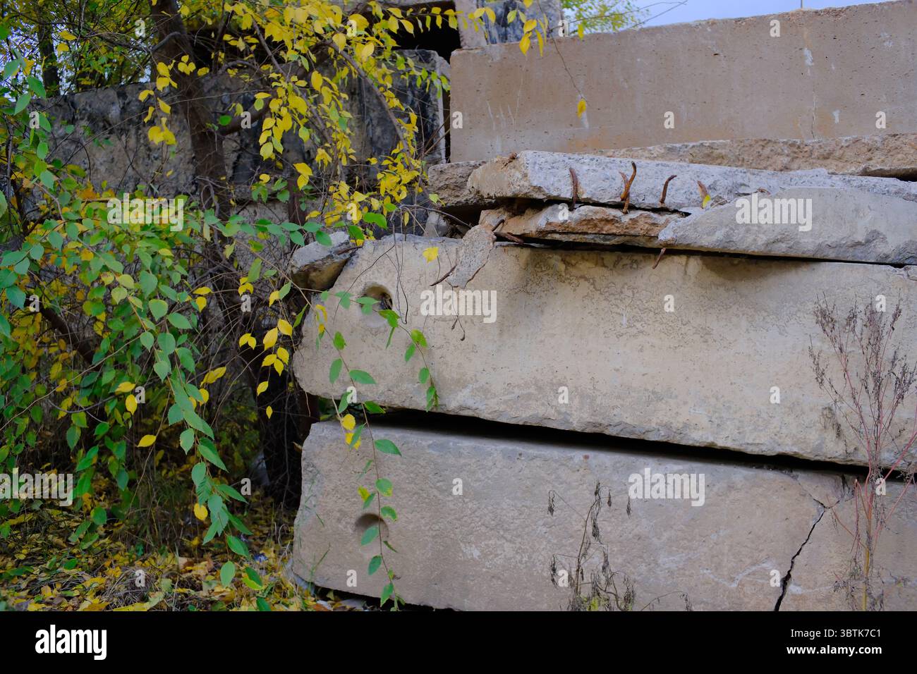 Large construction debris, concrete slabs and blocks lie in the city ...