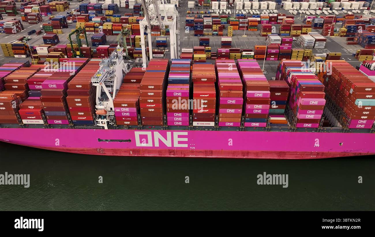 Long Beach, USA - 04 July 2025: Aerial view of a vibrant cargo ship ...
