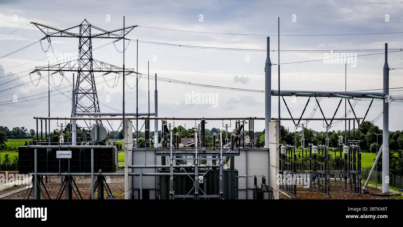 UTRECHT - High-voltage pylons in the landscape. Electric energy is ...