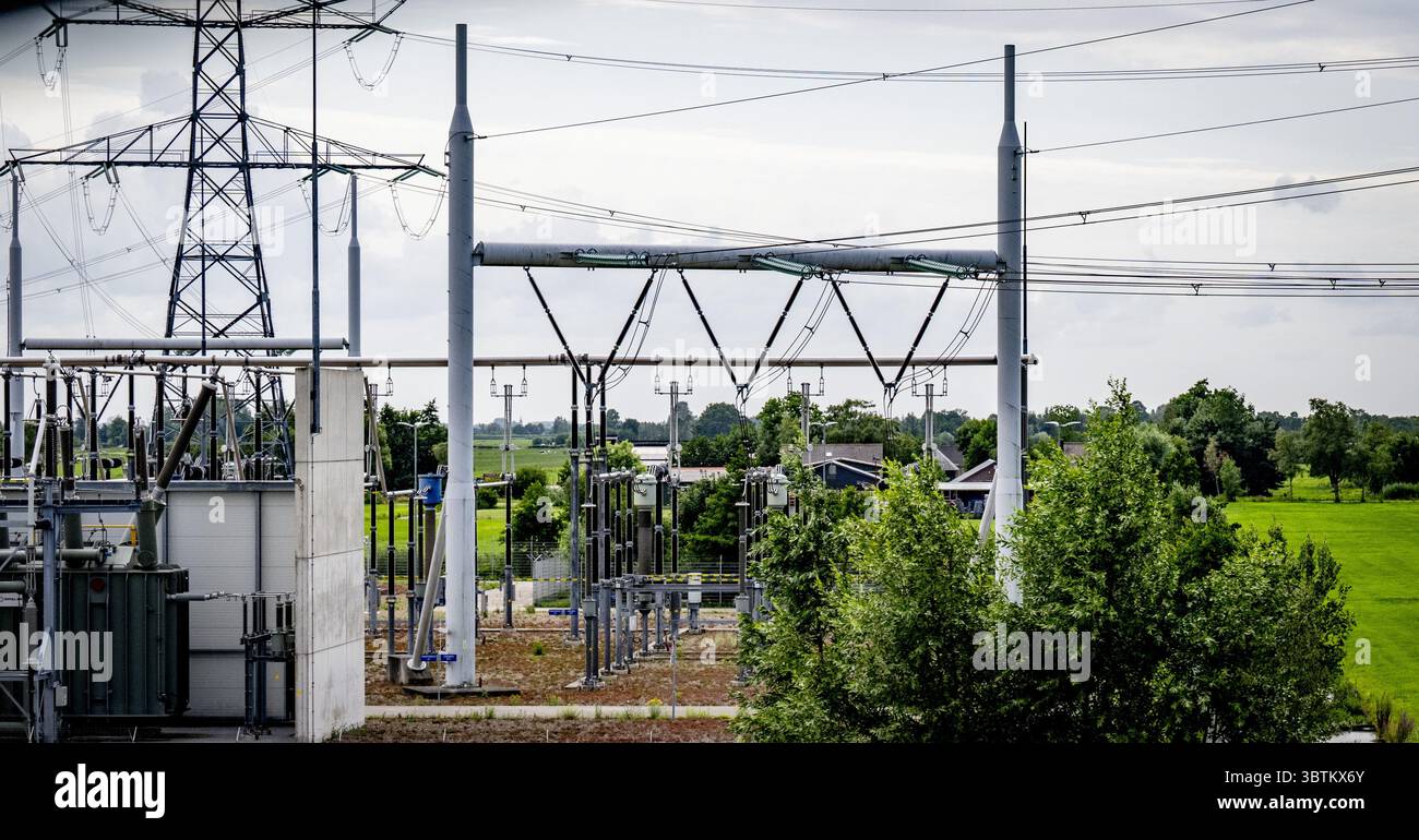 UTRECHT - High-voltage pylons in the landscape. Electric energy is ...