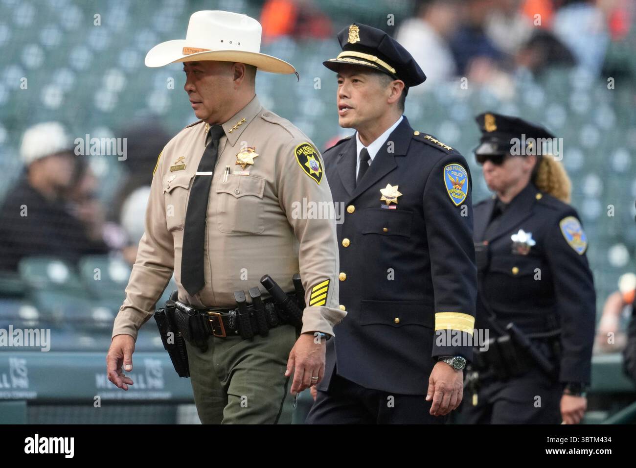 San Francisco Sheriff Paul Miyamoto, left, and San Francisco Police ...