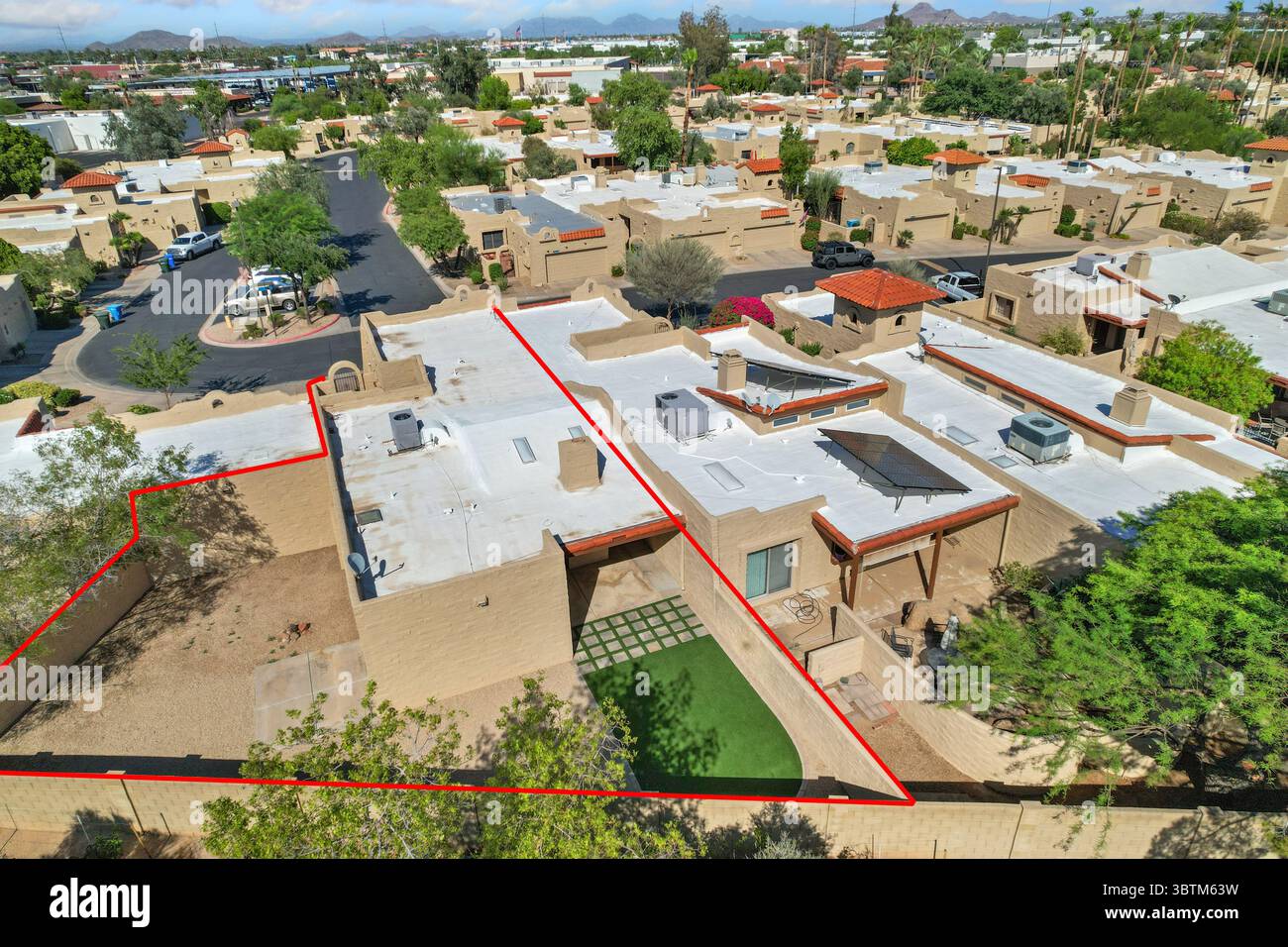 Aerial view of a residential area with a red line between houses Stock ...