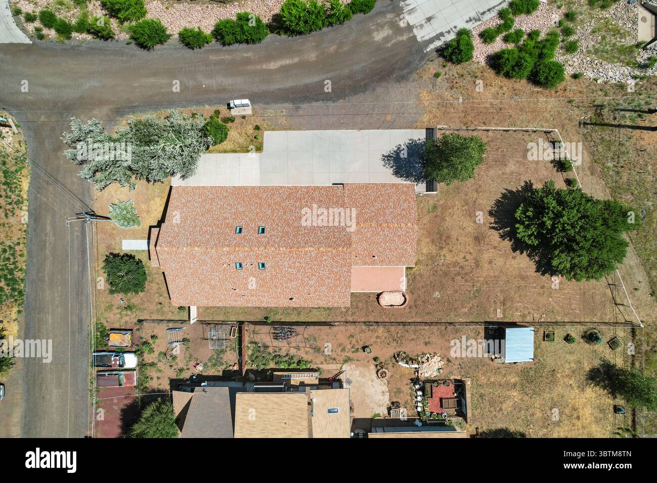 This is an aerial view captured from above of a single house situated ...