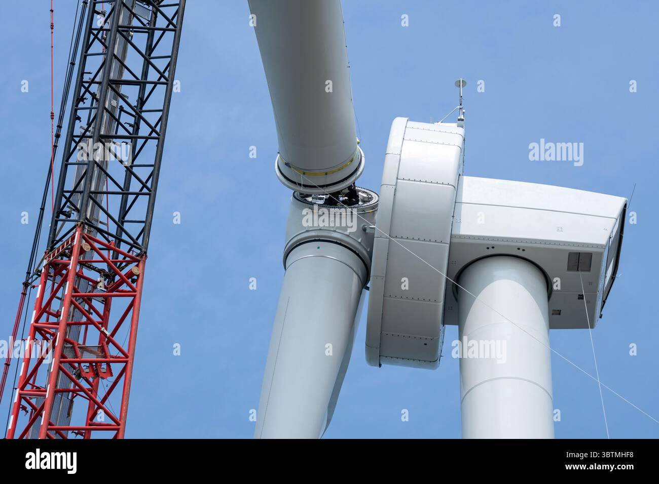 assembly of a rotor blade on a newly installed wind turbine Stock Photo ...