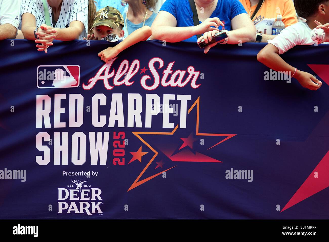 Fans wait for players to arrive on the red carpet for the MLB baseball All-Star game, Tuesday ...