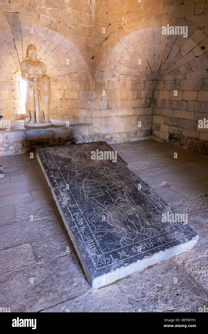 Tomb with engravings and a statue of a knight inside Beja Castle, a ...