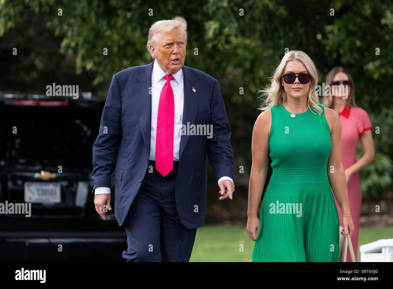 President Donald Trump with White House press secretary Karoline ...